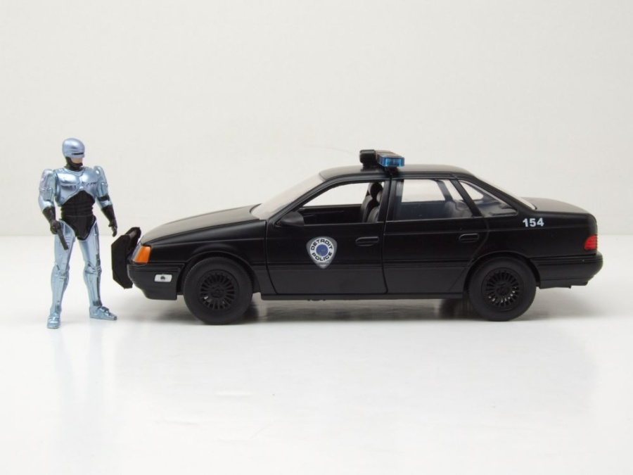 Ford Taurus Police 1986 schwarz RoboCop mit Figur Modellauto 1:24 Jada ...